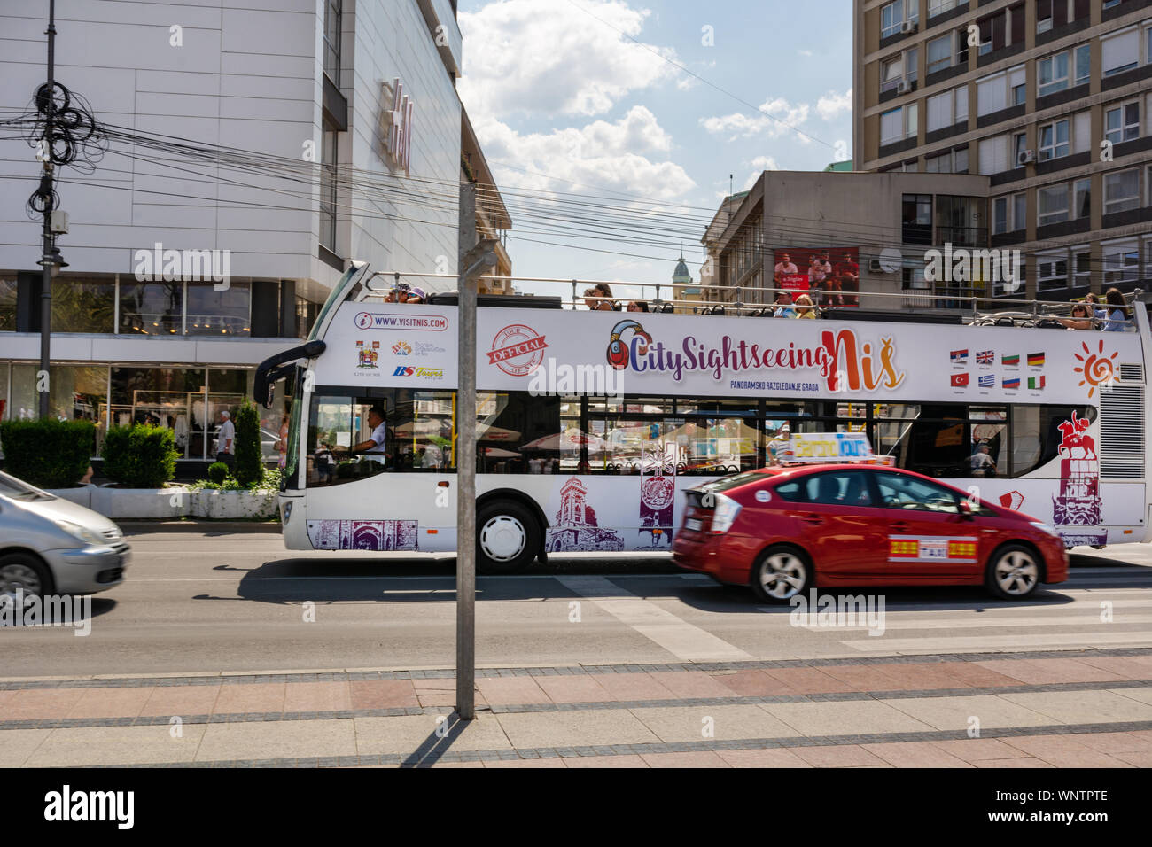 Nis, Serbia - August 28, 2019 Double decker bus with tourists driving ...