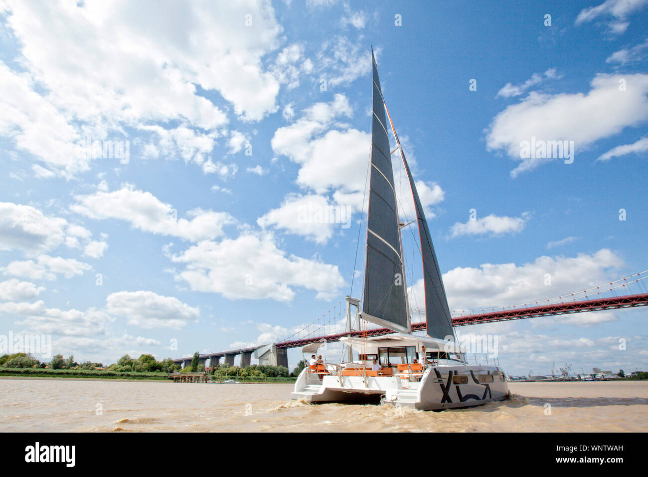 A catamaran cruising on the Garonne river, Bordeaux, Gironde, France ...
