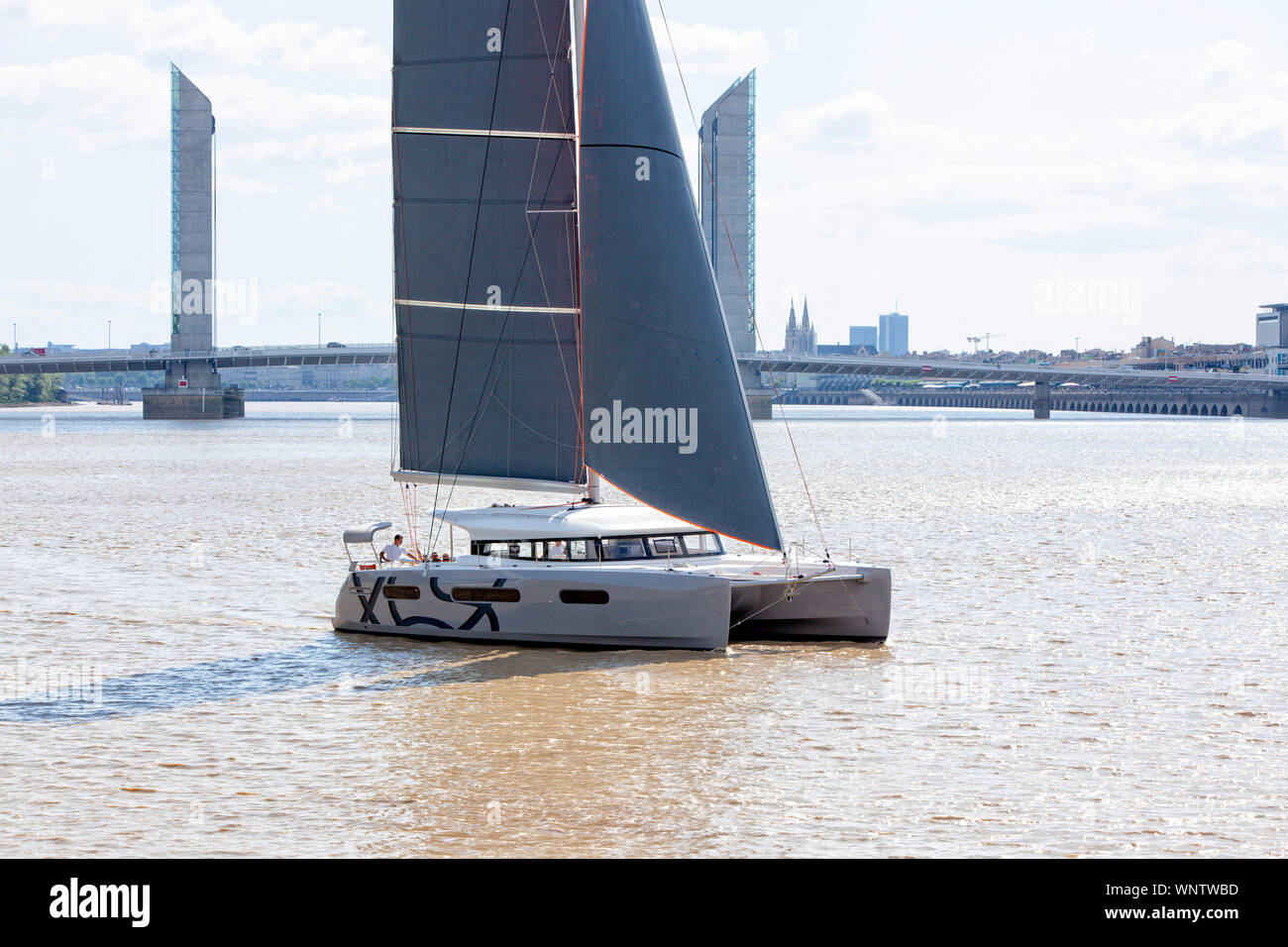 A catamaran cruising on the Garonne river, Bordeaux, Gironde, France ...