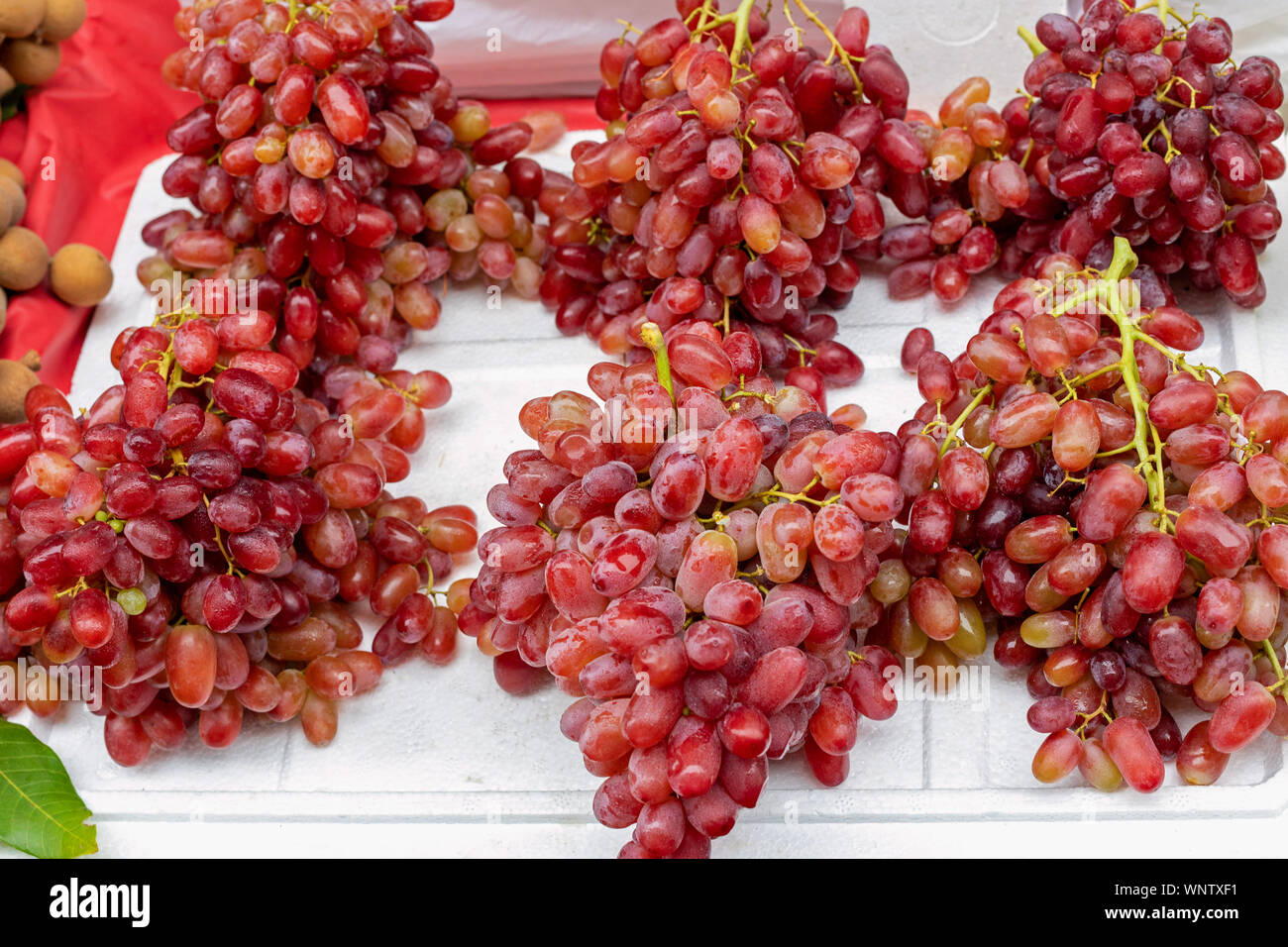 Red Grapes Fruits in Clusters at Market Stock Photo - Alamy