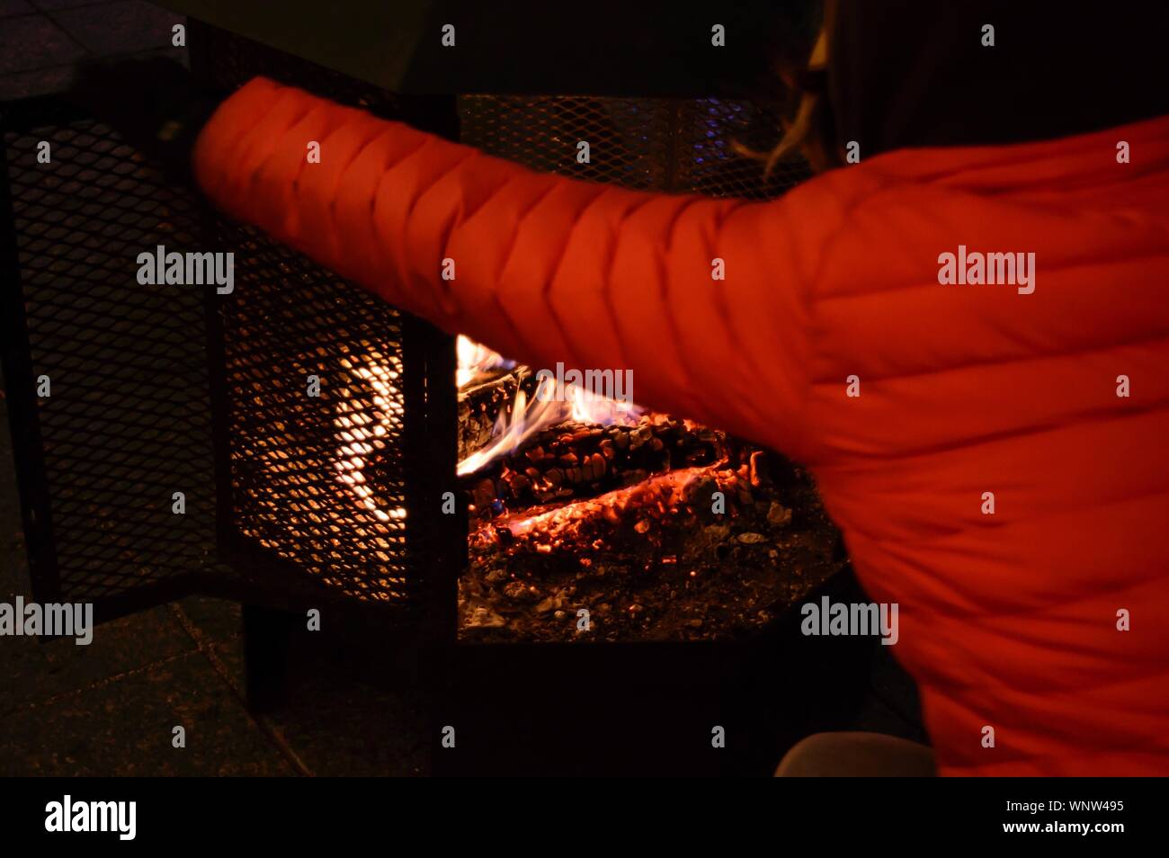 Woman at fire hi-res stock photography and images - Alamy
