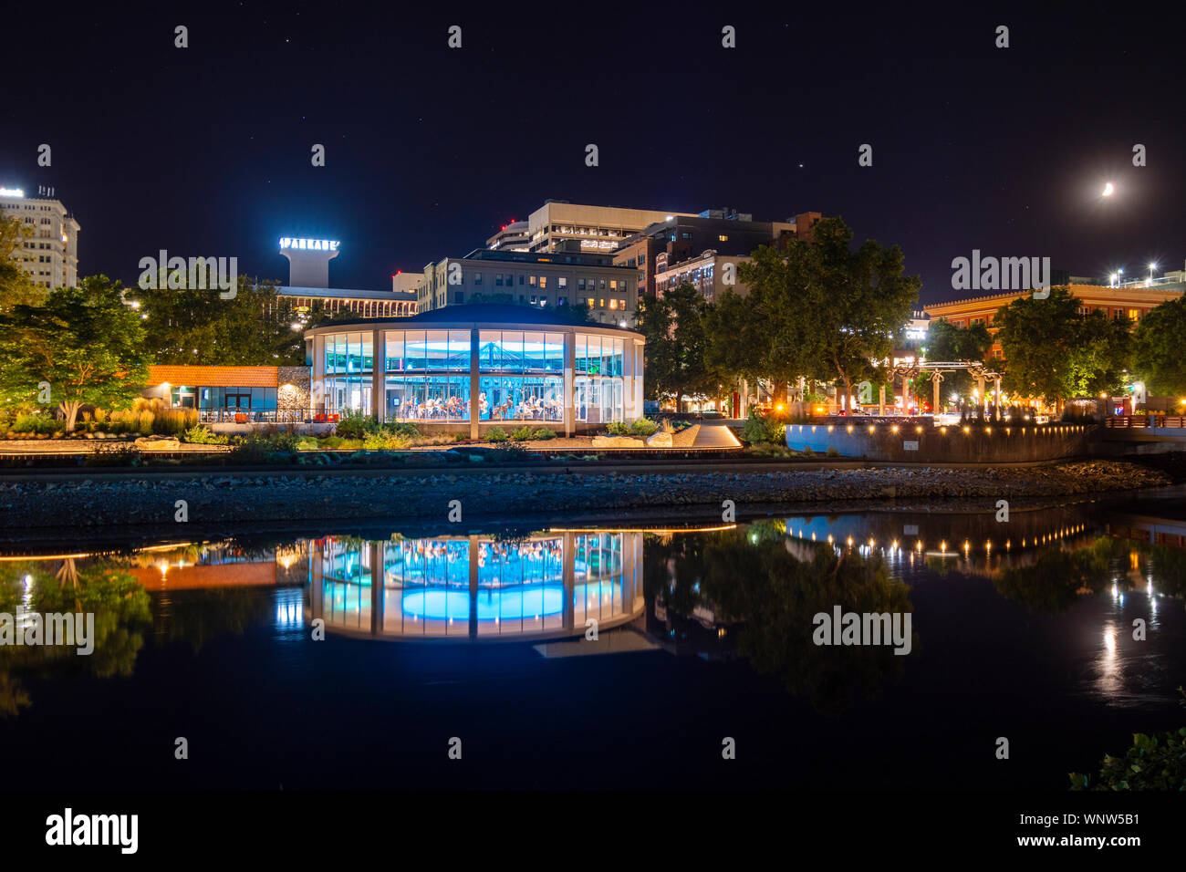 Evening at the illuminated Looff Carousel which runs along the Spokane ...