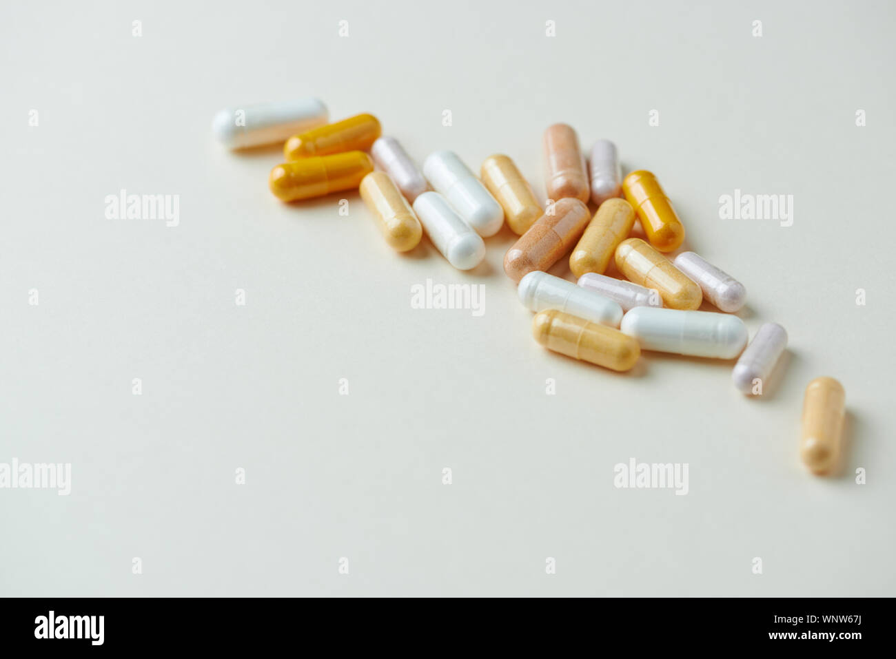 Vitamins and supplements on bright paper background. Concept for a ...