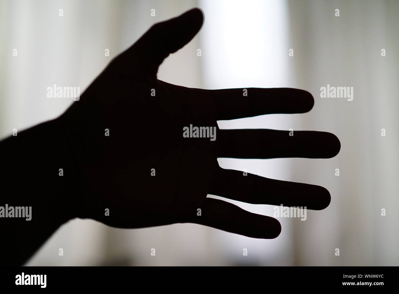 Hands shadow hi-res stock photography and images - Alamy