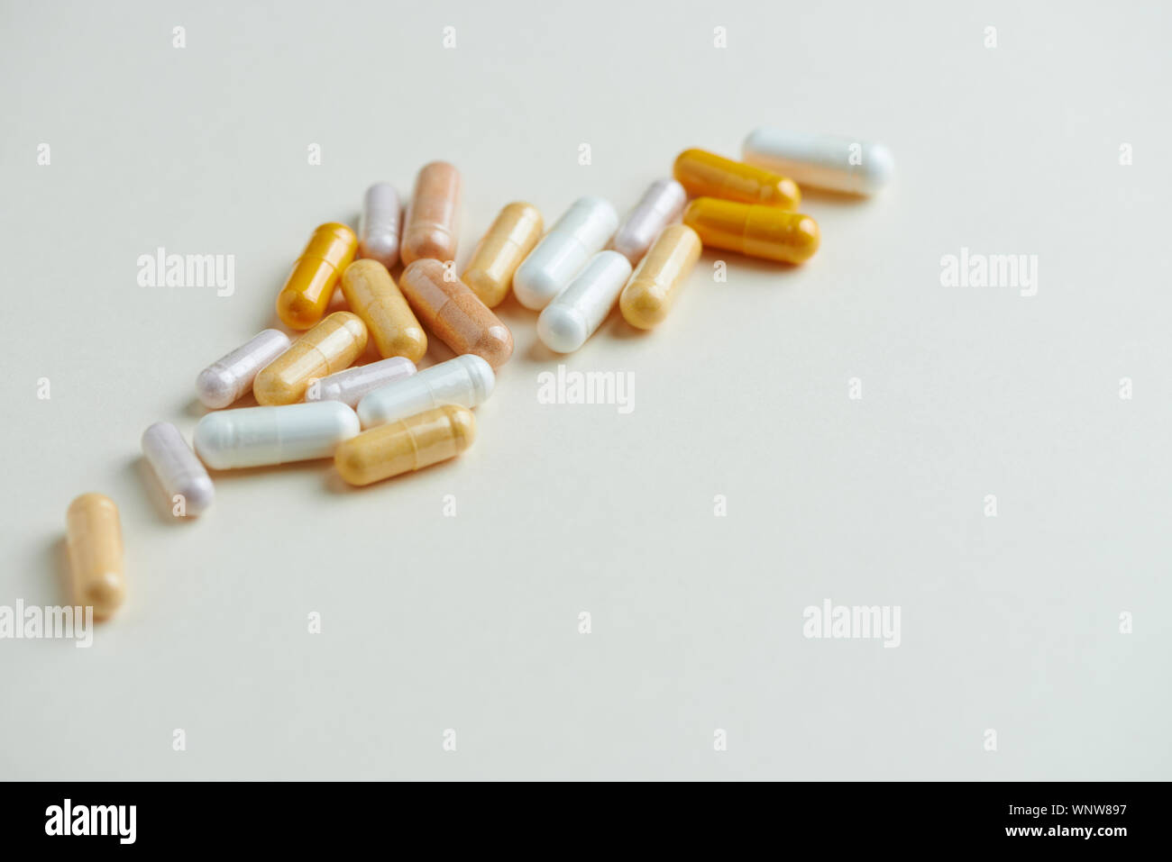 Vitamins and supplements on bright paper background. Concept for a ...