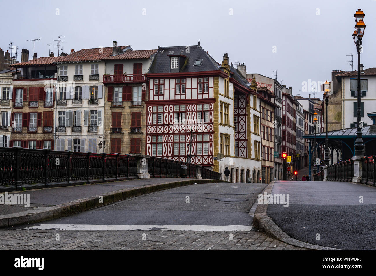 Bridge over Nive river in Bayonne with typical half timbered houses in ...
