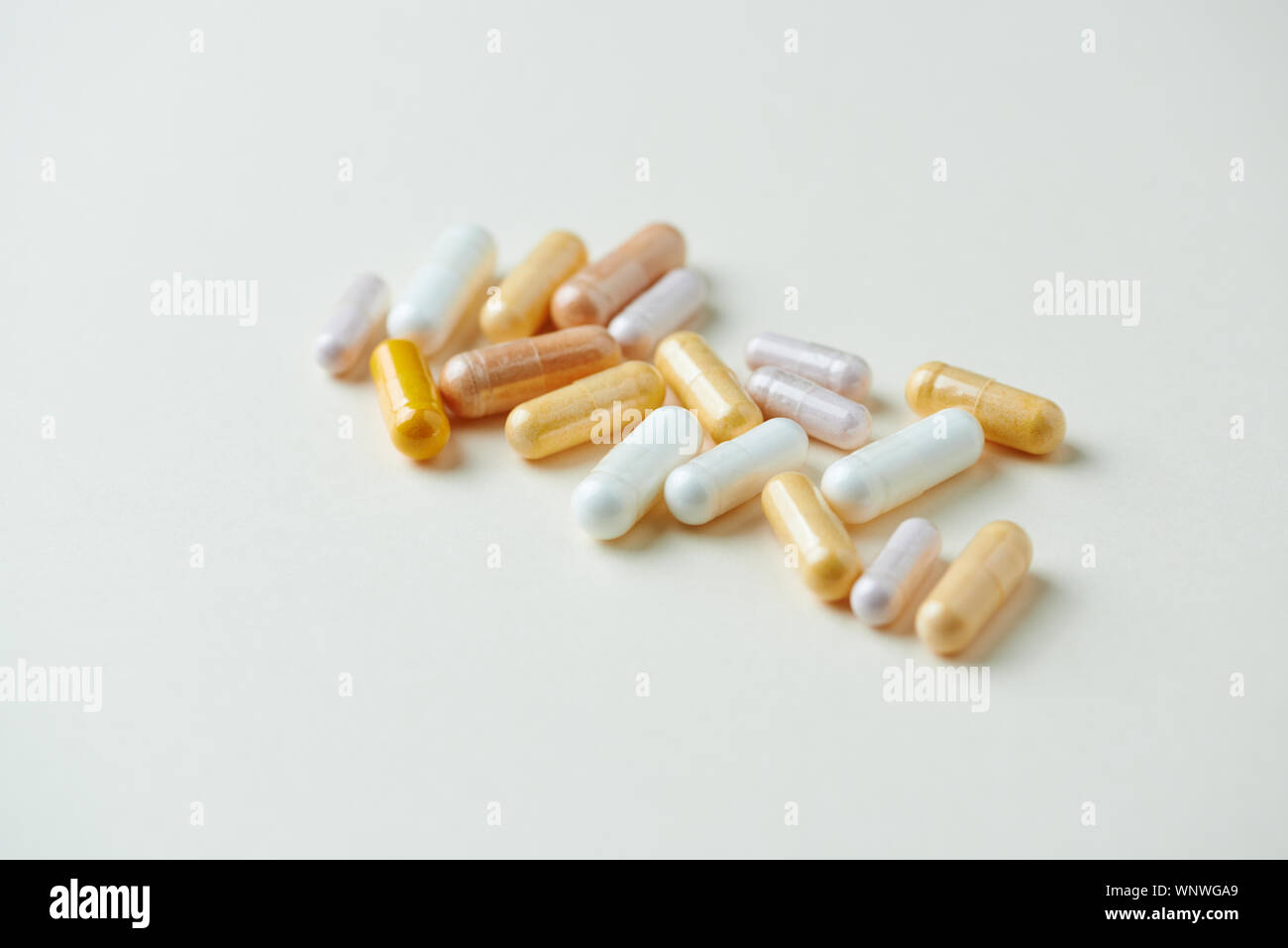 Vitamins and supplements on bright paper background. Concept for a ...