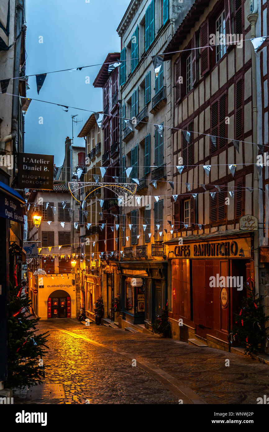 Picturesque view of Bayonne old town in the evening with typical half ...