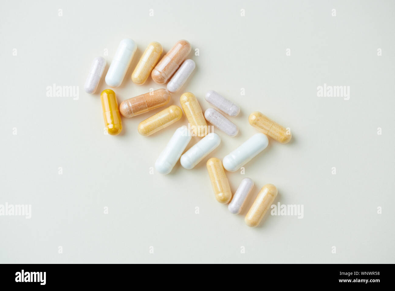 Vitamins and supplements on bright paper background. Concept for a ...