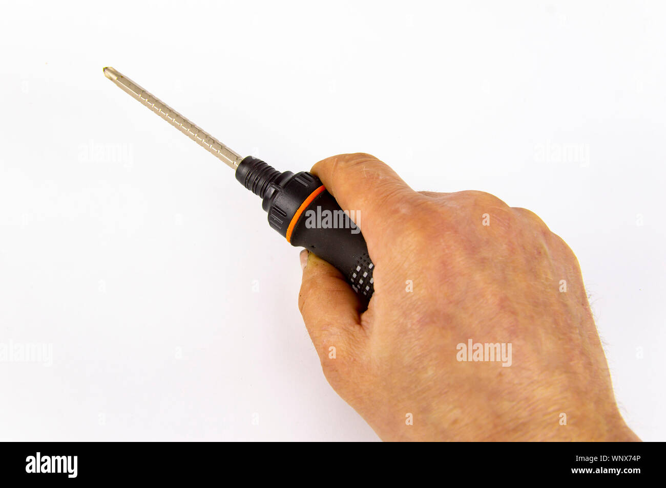 Screwdriver tool in man's hand, isolated on white background, there is ...