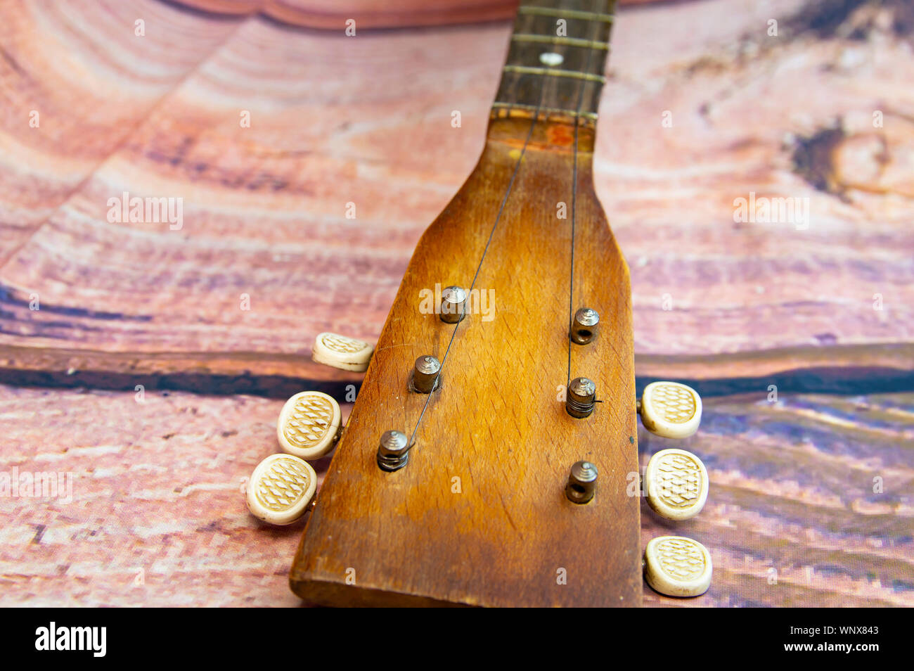 Balalaika - musical stringed instrument, wooden, brown. Strings, neck ...
