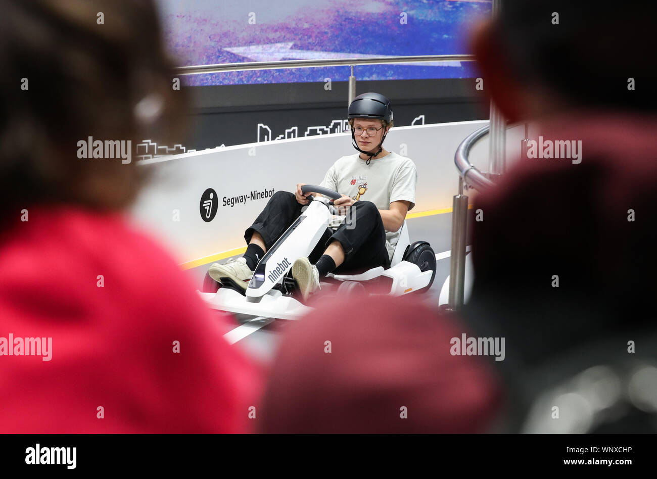Berlin, Germany. 6th Sep, 2019. A visitor drives a Ninebot Gokart at ...