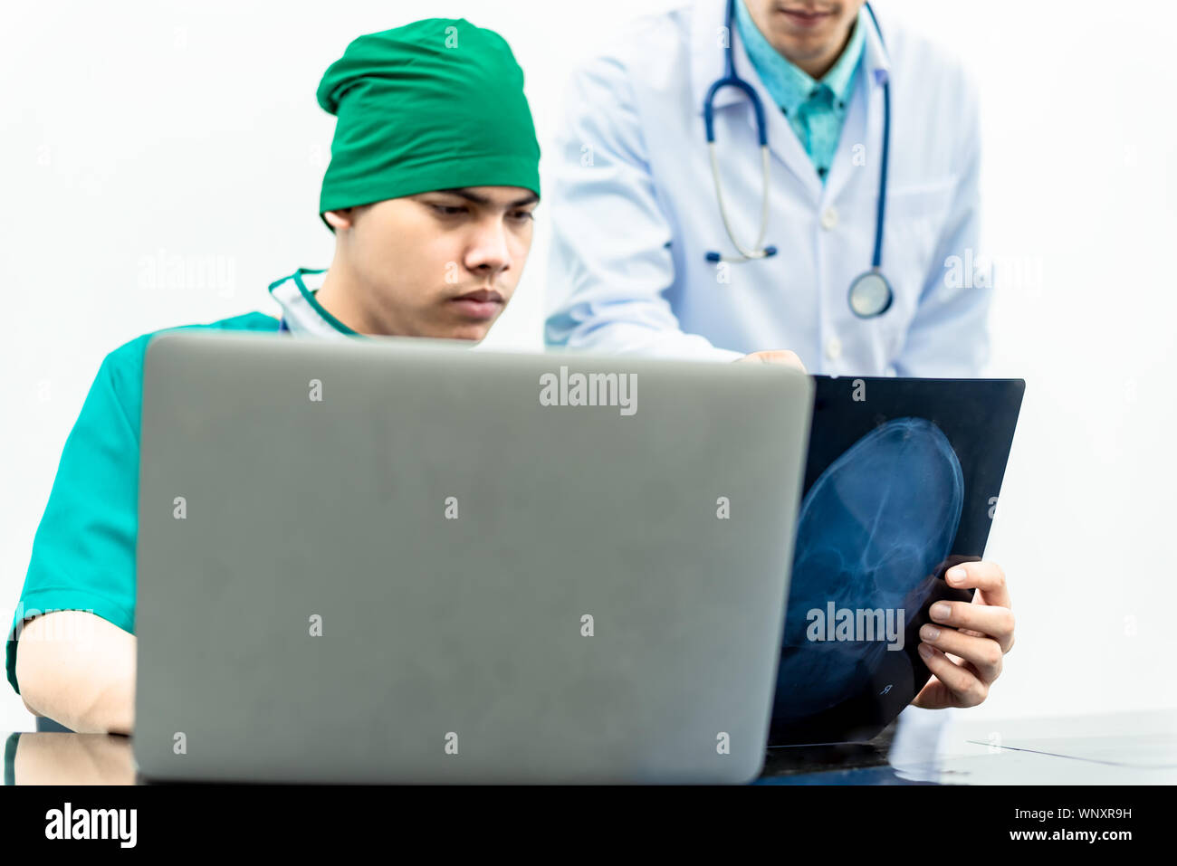 Teamwork of professional doctor men medical team consulting with x-ray ...