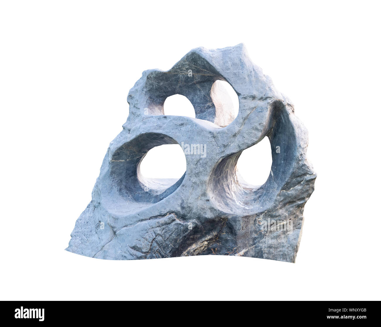 Abstract of big granite ,marble rock stone with holes in the garden zen ...