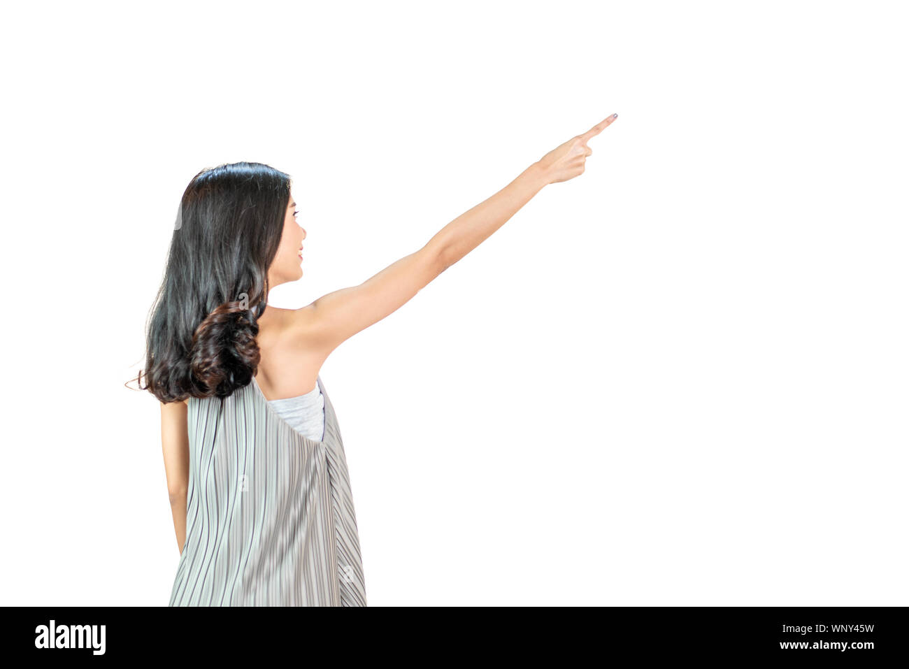 Back side body of Young asian woman standing pointing to something,long ...