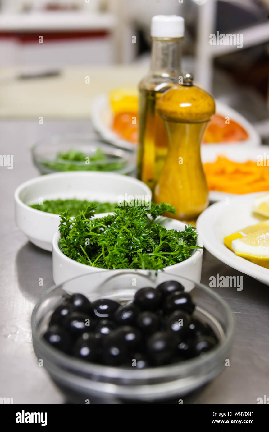 Healthy ingredients on a restaurant kitchen table, ready to go for the ...