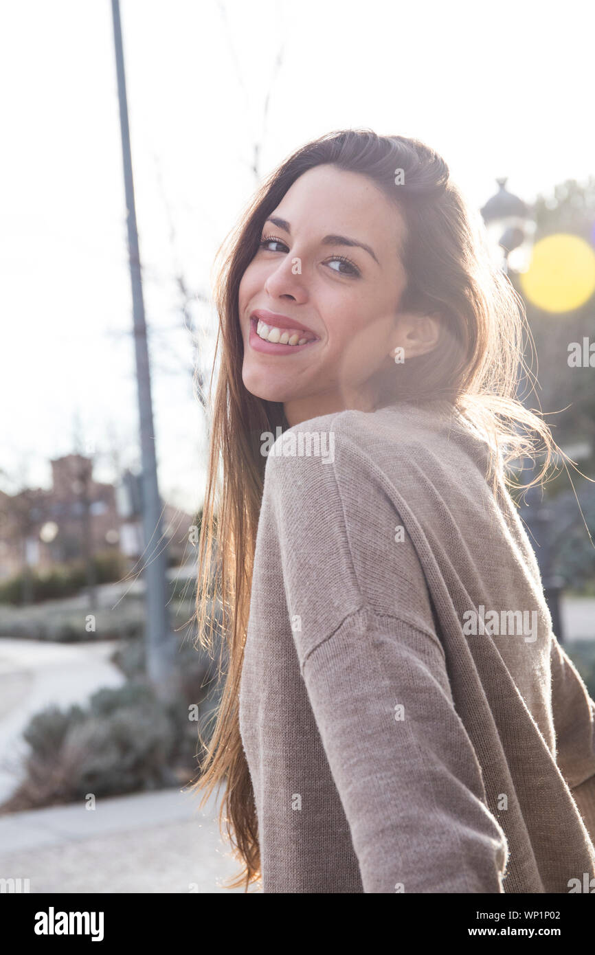 One woman alone smiling sitting hi-res stock photography and images - Alamy