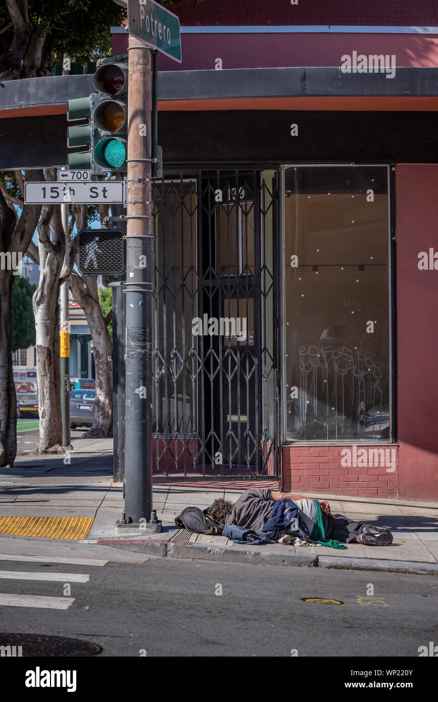 Homeless man sleeping on sidewalk hi-res stock photography and images ...
