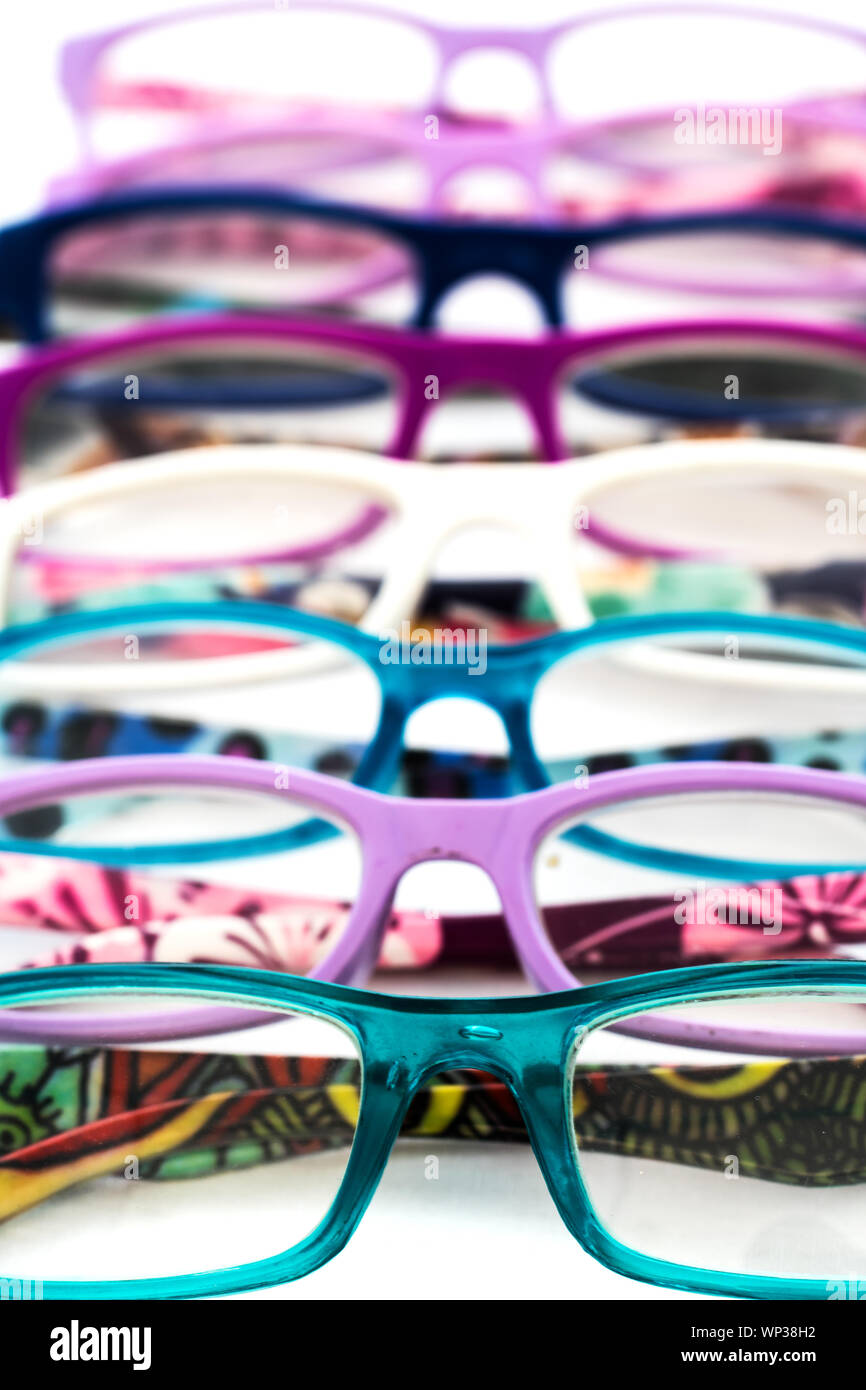 multiple colored eye glasses smudged and lined on white background. Eye ...