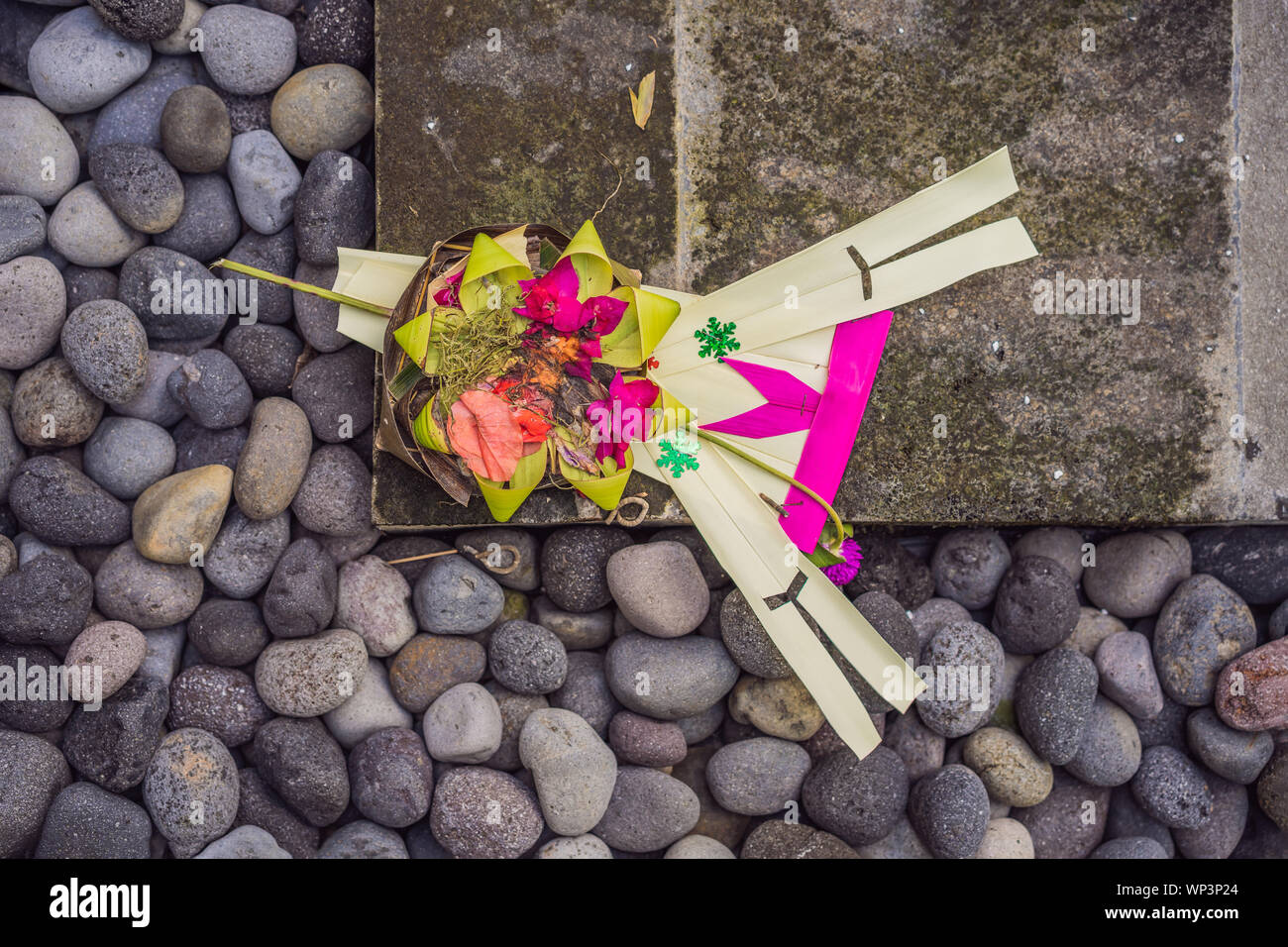 Traditional balinese offerings to gods in Bali with flowers and ...