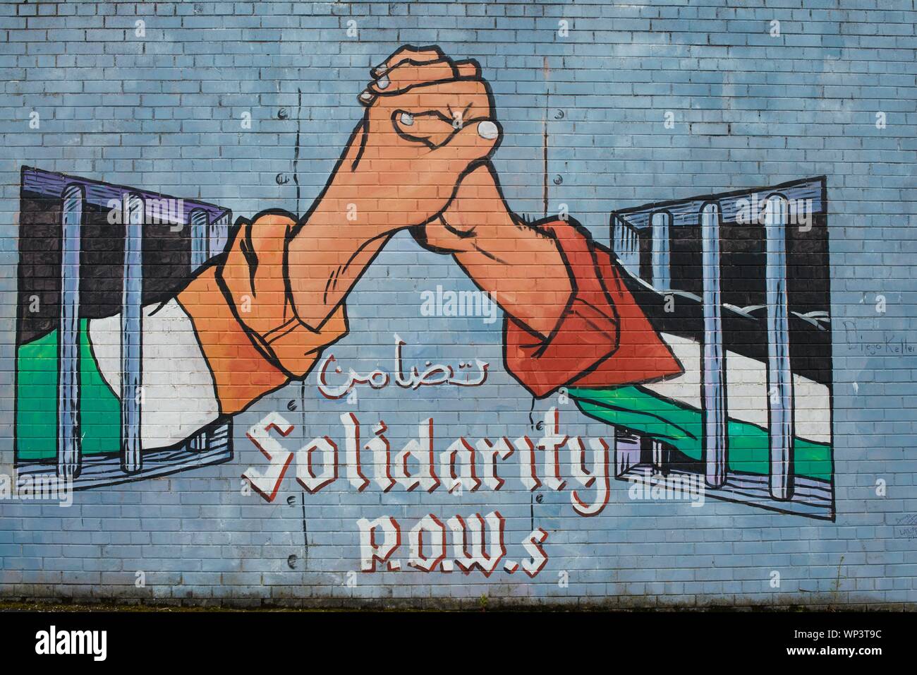 Mural, political graffiti on wall in West Belfast reminding of the ...