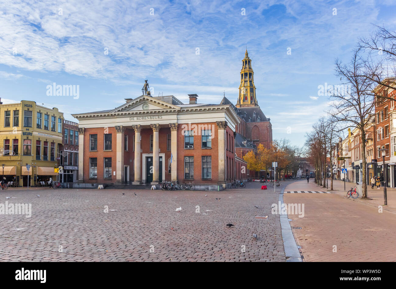 Grain exchange building and church tower at the fish market square in ...