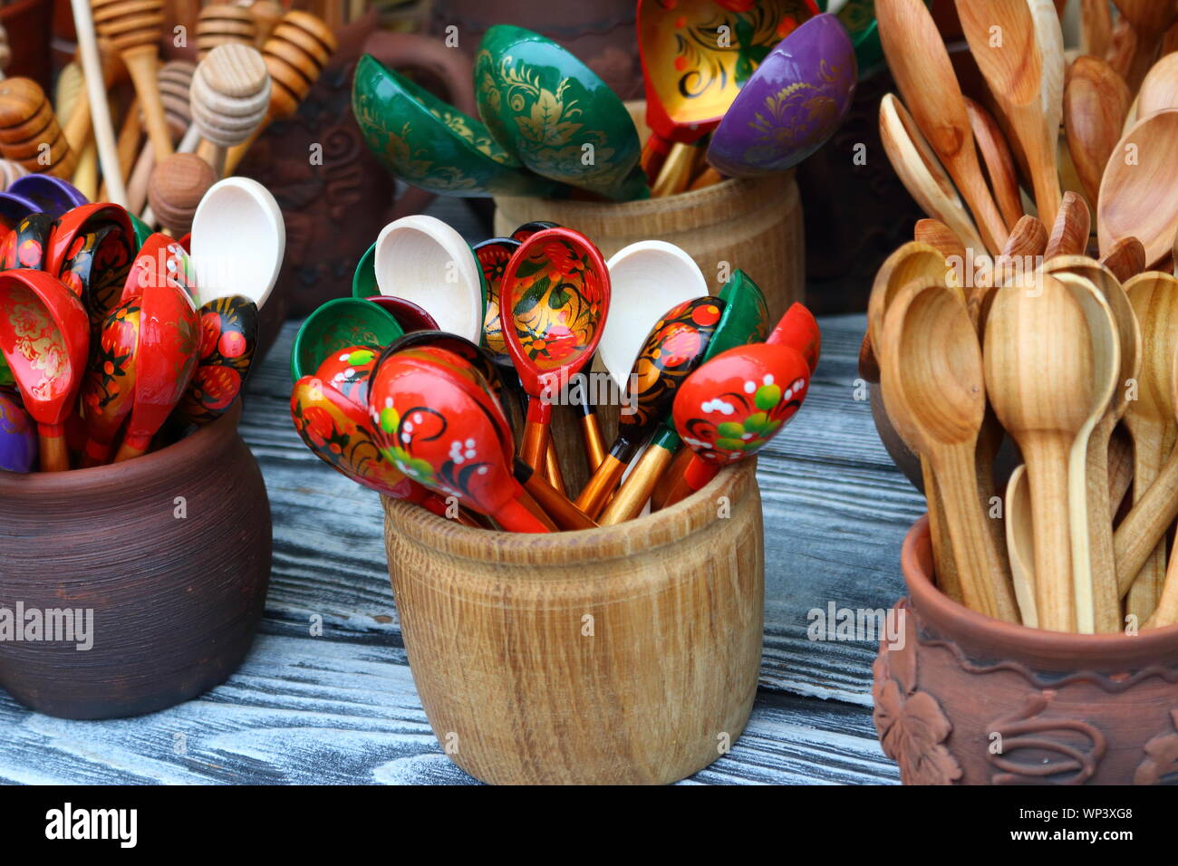Sale of wooden spoons. Folk craft Stock Photo - Alamy