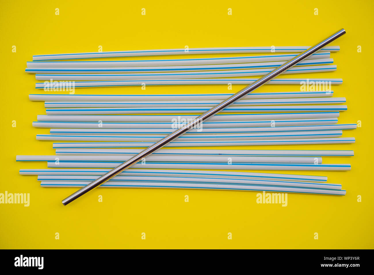 Steel drinking vs disposable straws on a yellow background. Zero waste ...
