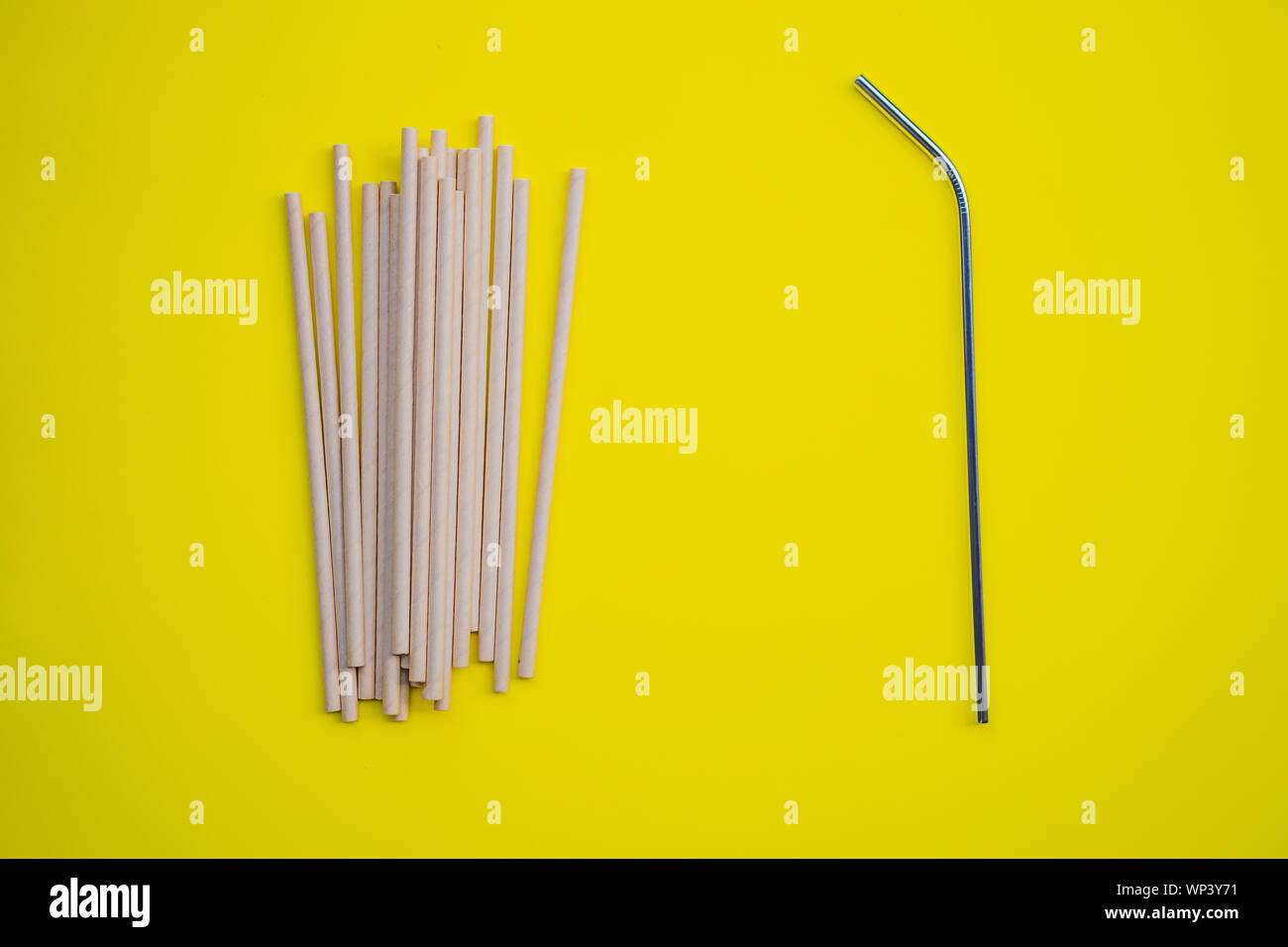 Steel drinking vs disposable straws on a yellow background. Zero waste ...