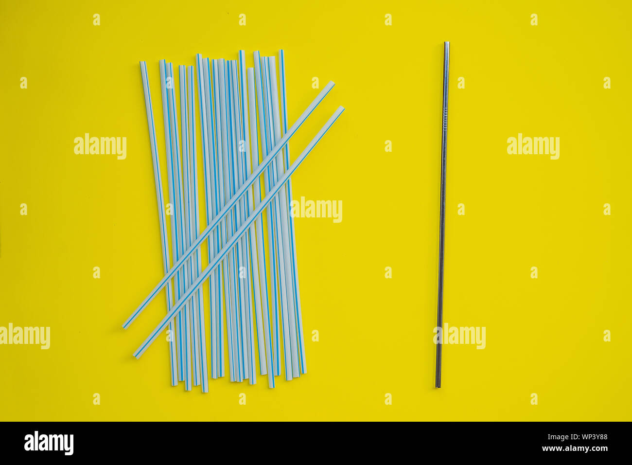 Steel drinking vs disposable straws on a yellow background. Zero waste ...