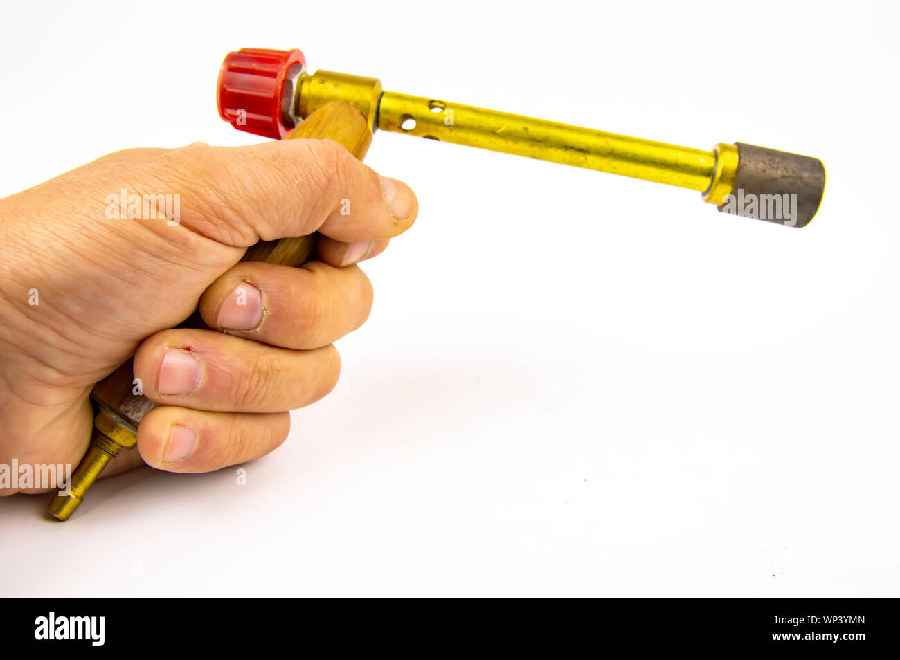 torch for welding in the hands of man on a white background, space for ...