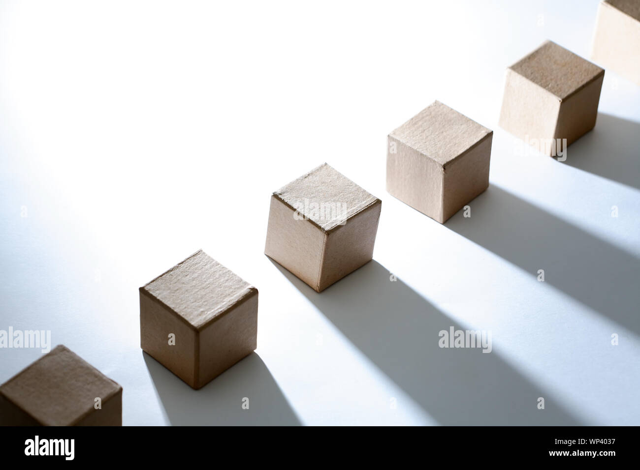 Set of cardboard cubes on white background with light and shadows Stock ...