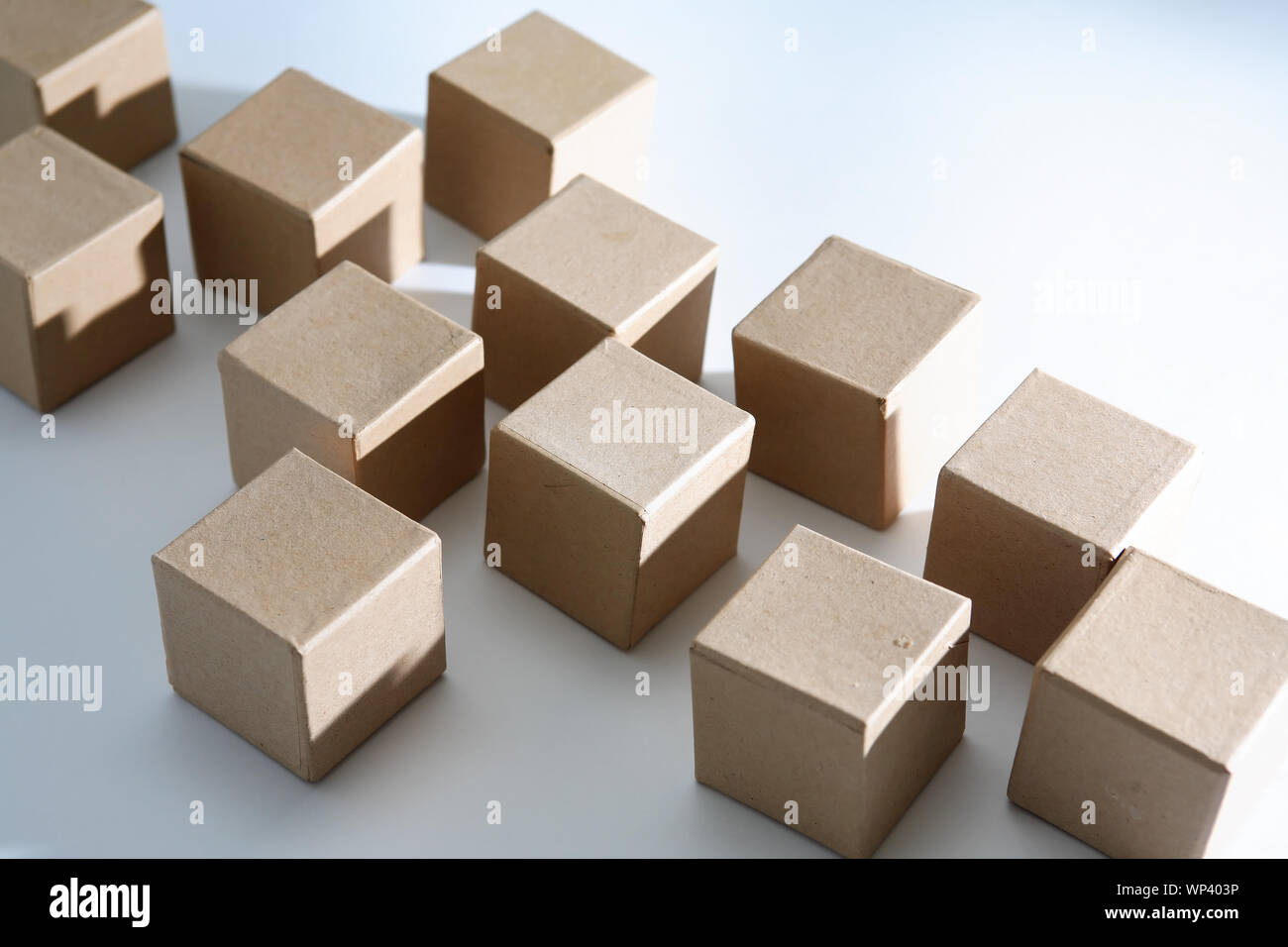Set of cardboard cubes on white background with light and shadows Stock ...