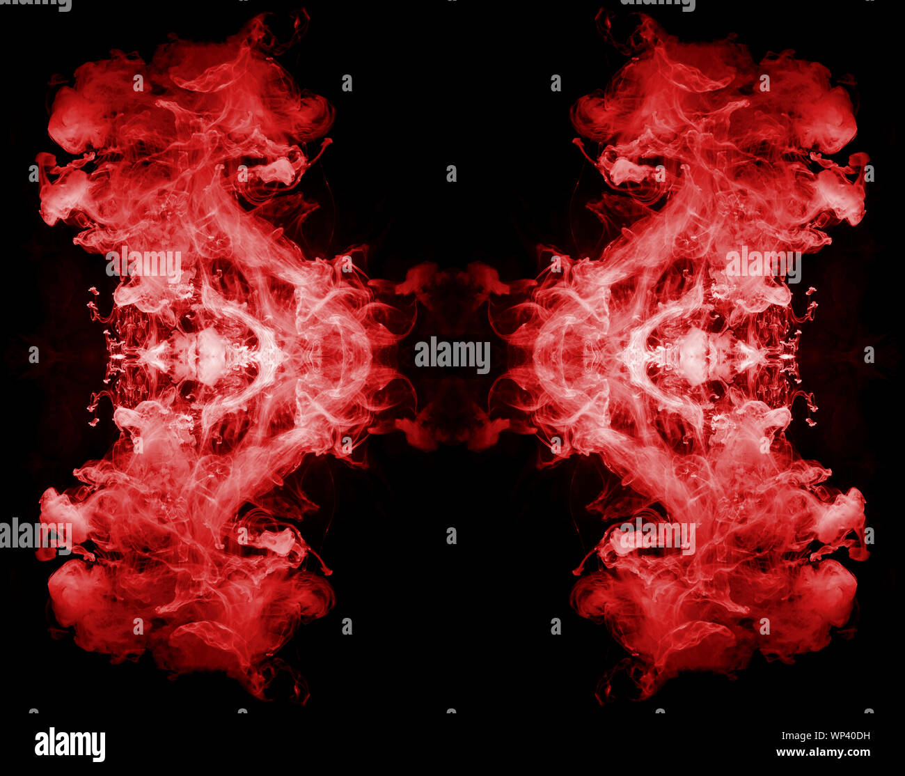 Red ink forming patterns resembling Rorschach Test ink blots Stock ...