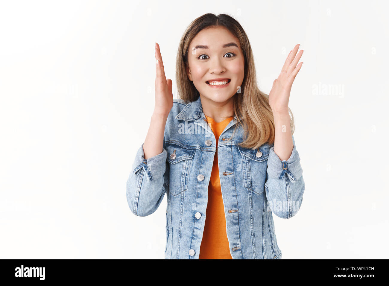 Excited happy triumphing young cute asian girl explaining awesome news ...