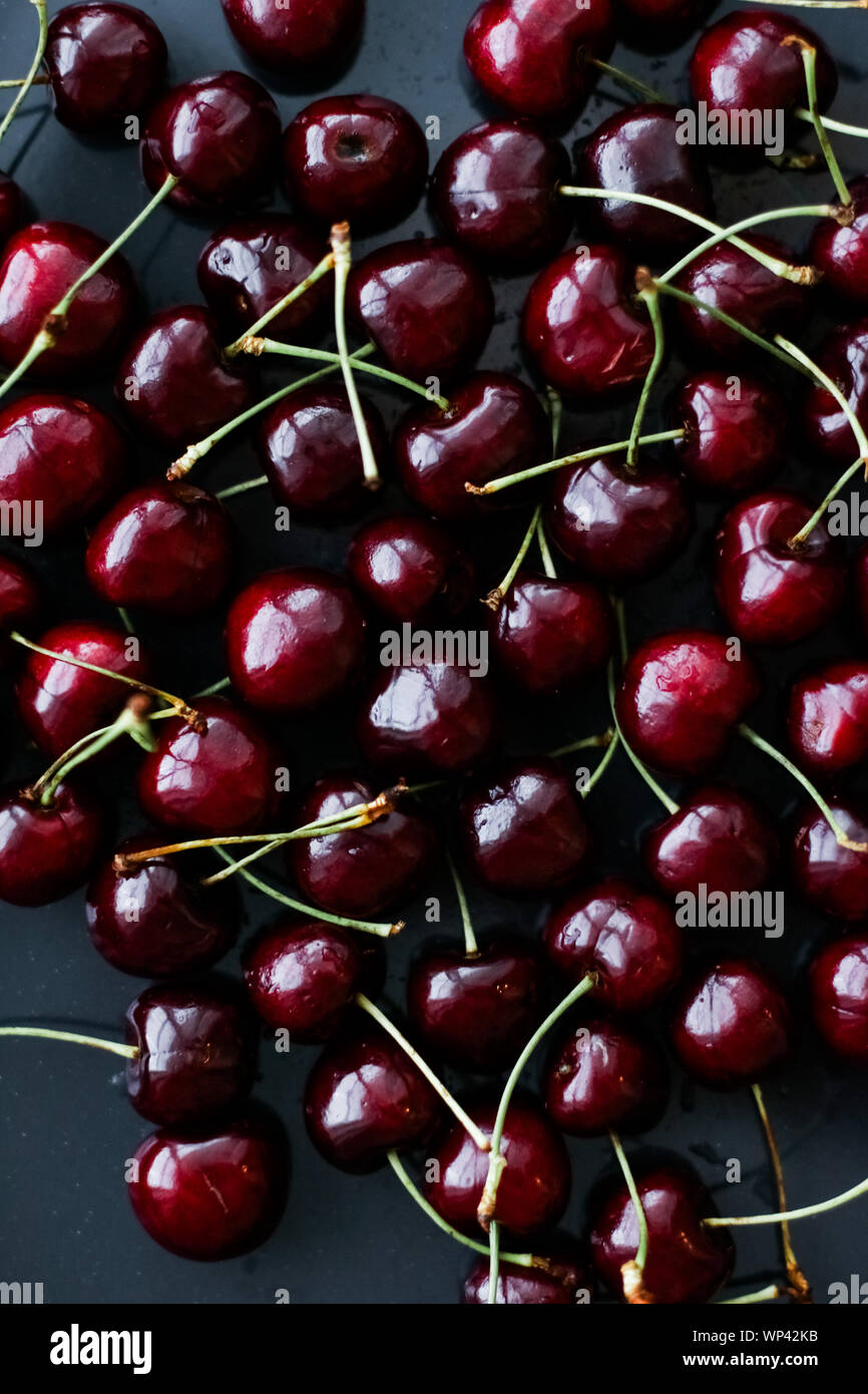 Organic food, vegan dieting and health concept - Fresh sweet cherries ...