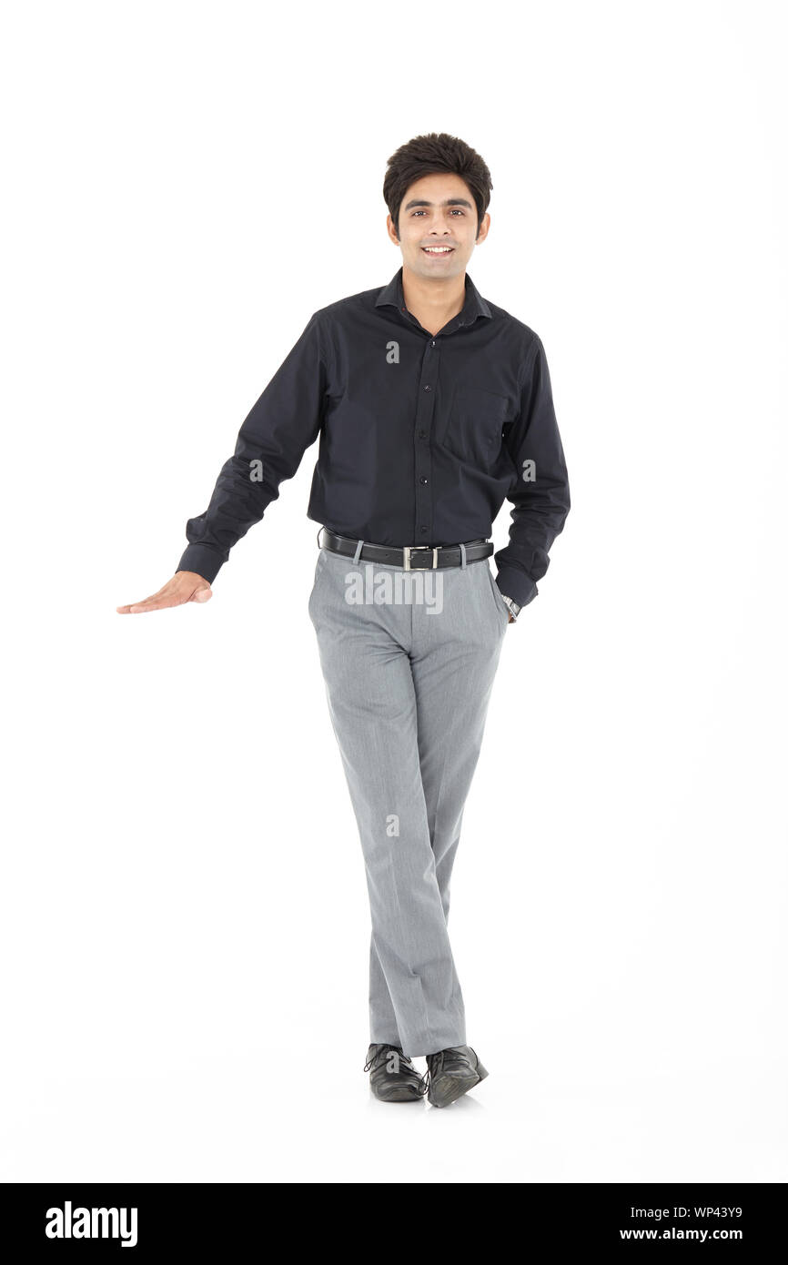 Businessman indicating size with his hand Stock Photo - Alamy