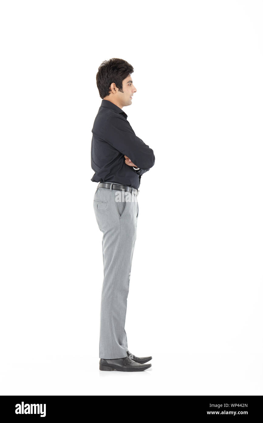Businessman standing with his arms crossed Stock Photo - Alamy
