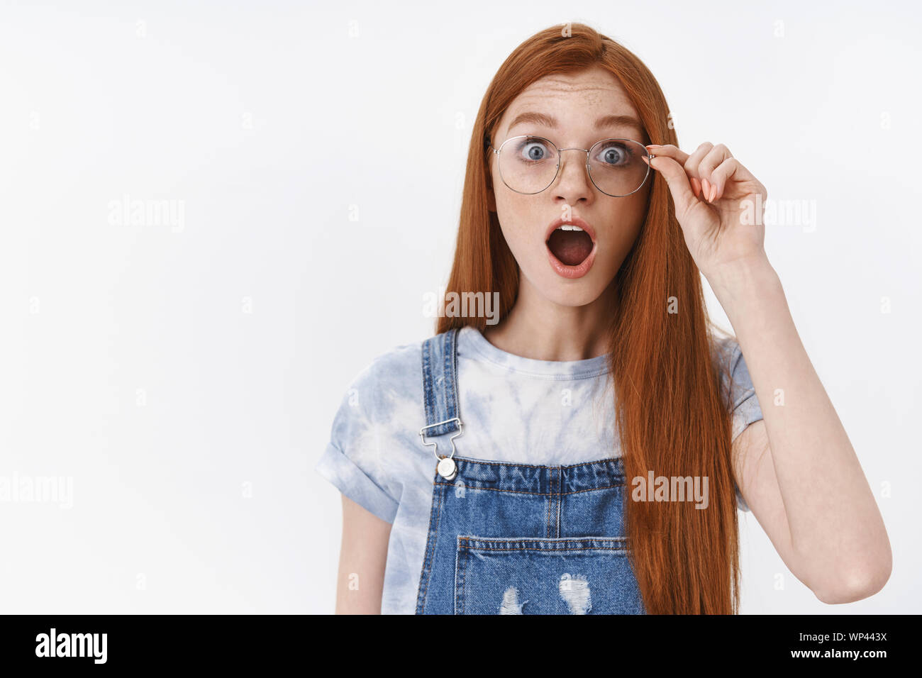 Waist-up shocked impressed cute teenage girl speechless stare camera ...