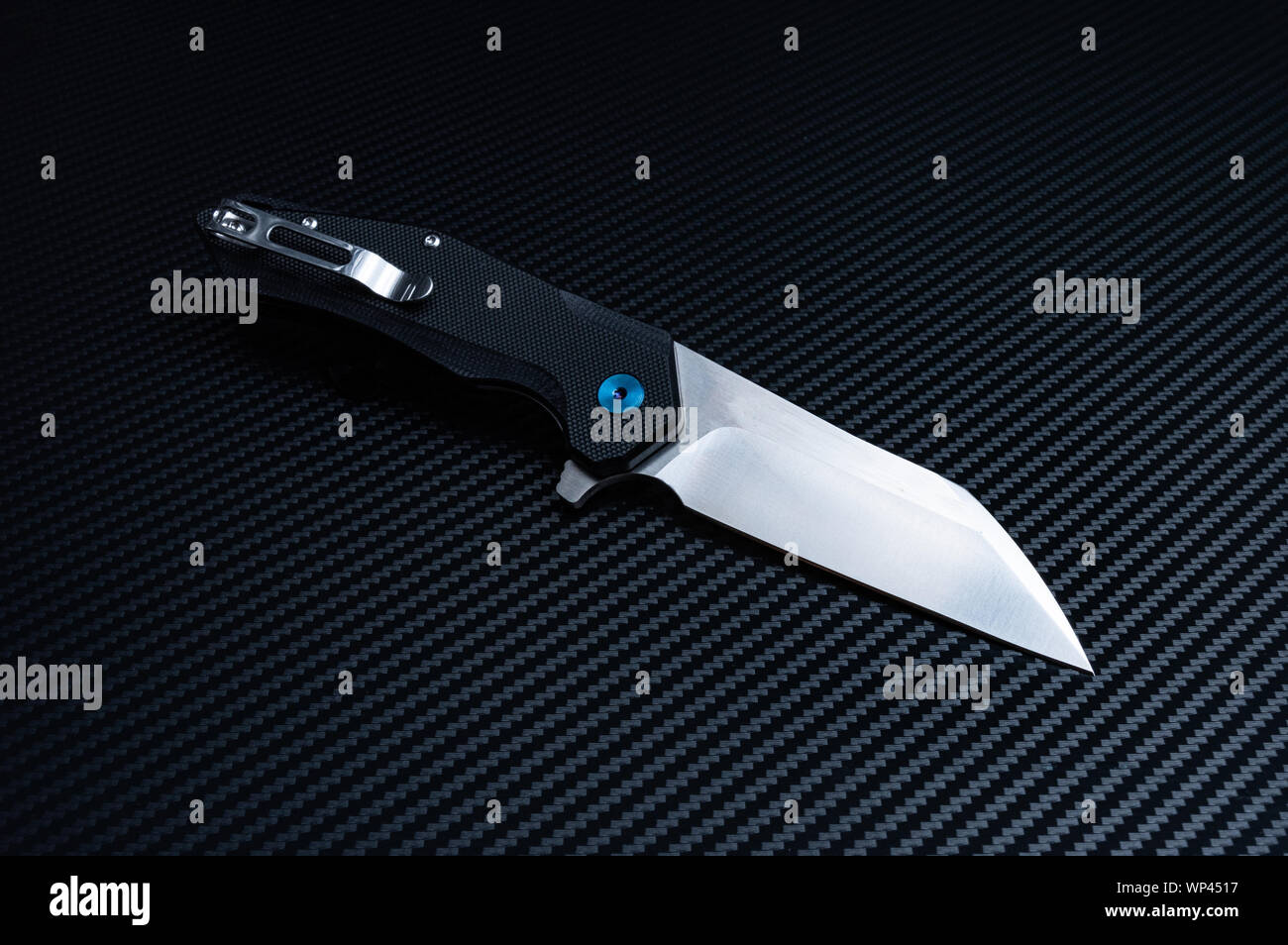 The reverse side of the knife. Clip on the knife handle. Polished knife ...