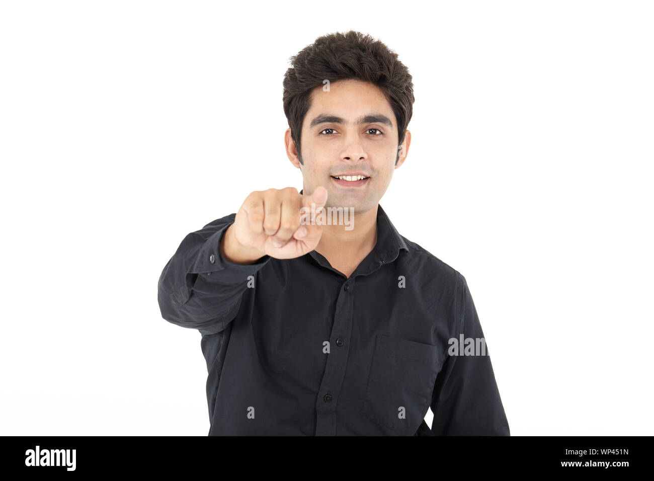 Portrait of businessman pointing towards camera Stock Photo - Alamy