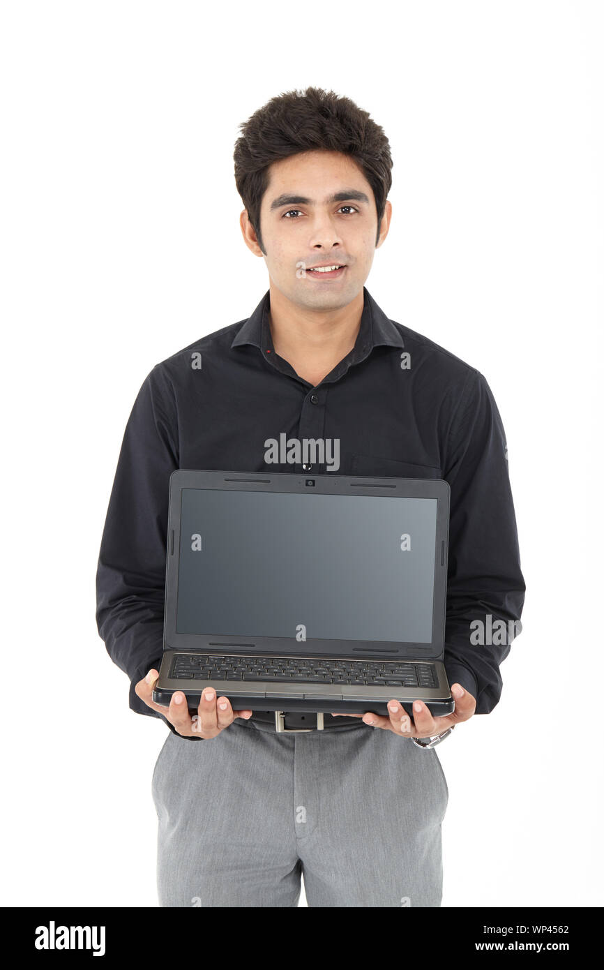 Salesman showing a laptop Stock Photo - Alamy