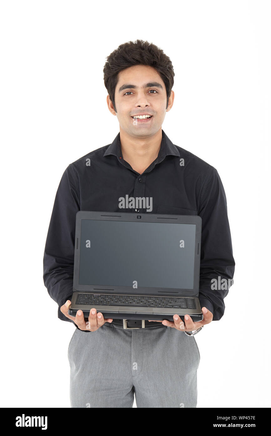 Salesman showing a laptop Stock Photo - Alamy