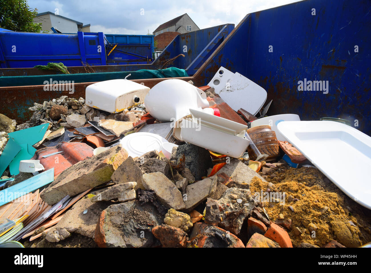 skip full of hardcore and rubble at concil houshold recycling centre ...