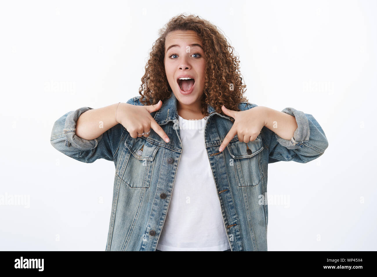 Excited Positive Charismatic Curly Haired European Woman Blue Eyes