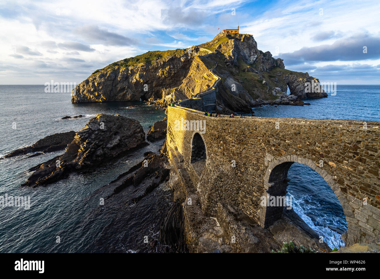 Scenic bridge connecting San Juan de Gaztelugatxe with the mainland ...