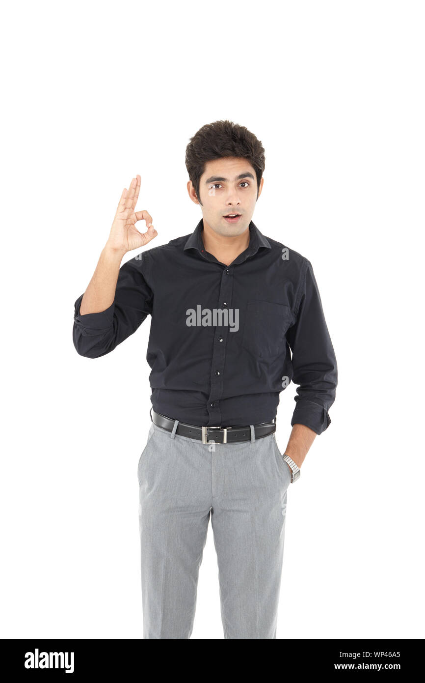 Businessman showing ok sign Stock Photo - Alamy