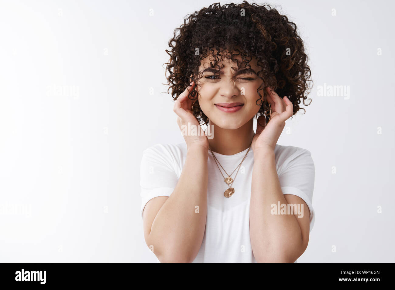 Cute girl cringing cannot stand loud places wrinkle nose feel disturbed ...