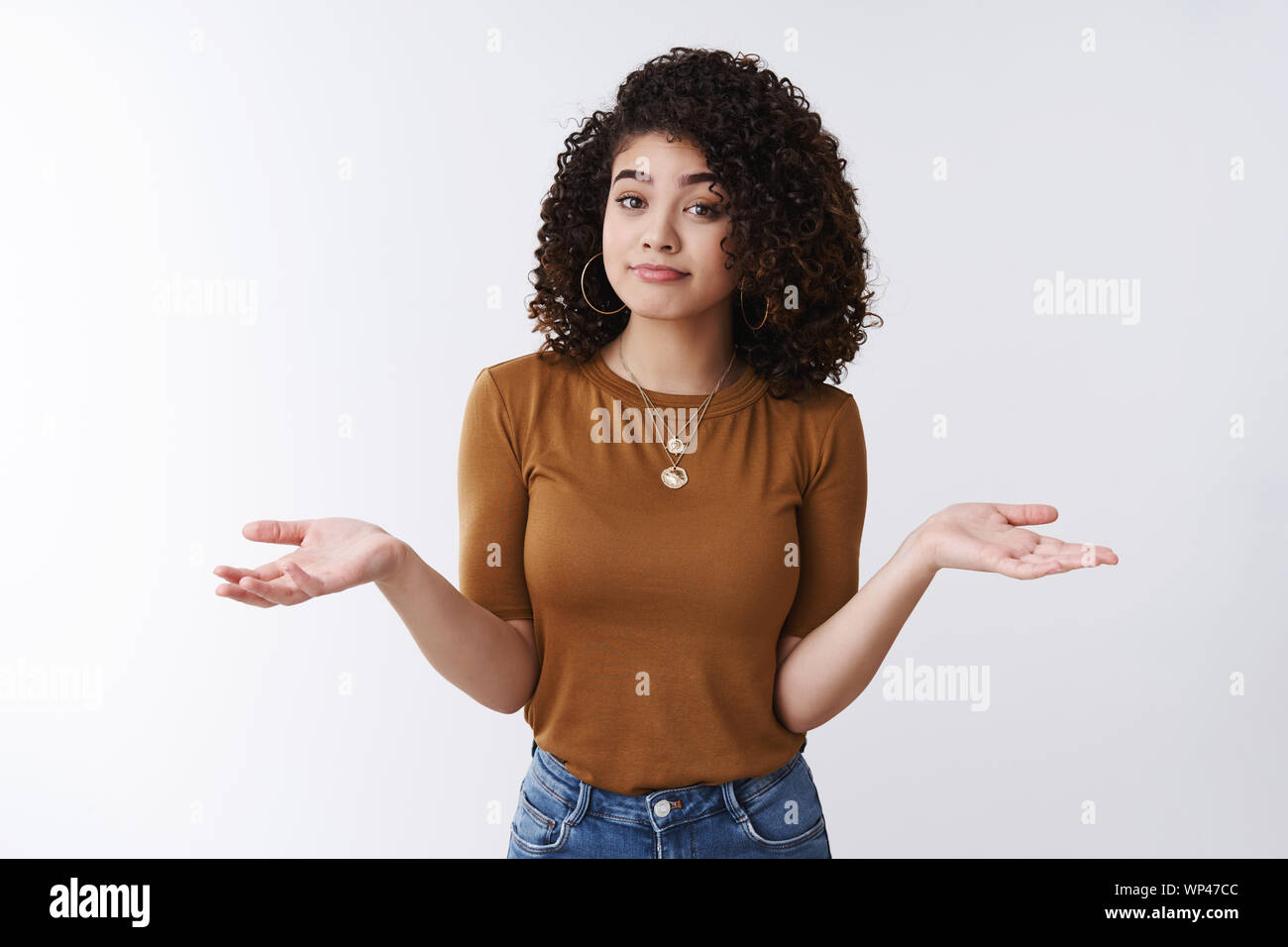 Not big deal. Unbothered careless stylish young modern female curly ...