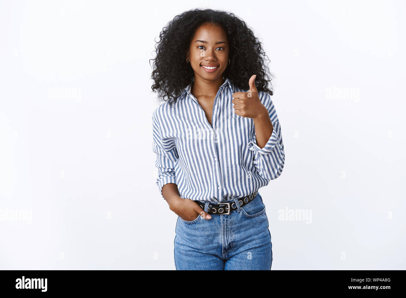 Good job. Satisfied businesswoman showing thumb up pleased nice work ...